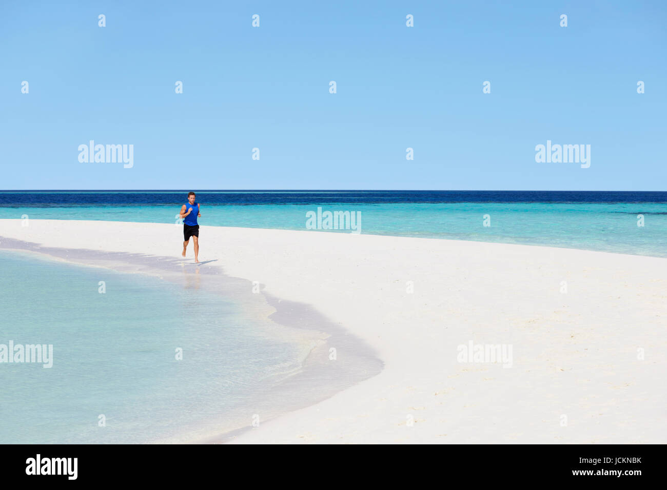Man Running On Beautiful Beach Stock Photo - Alamy
