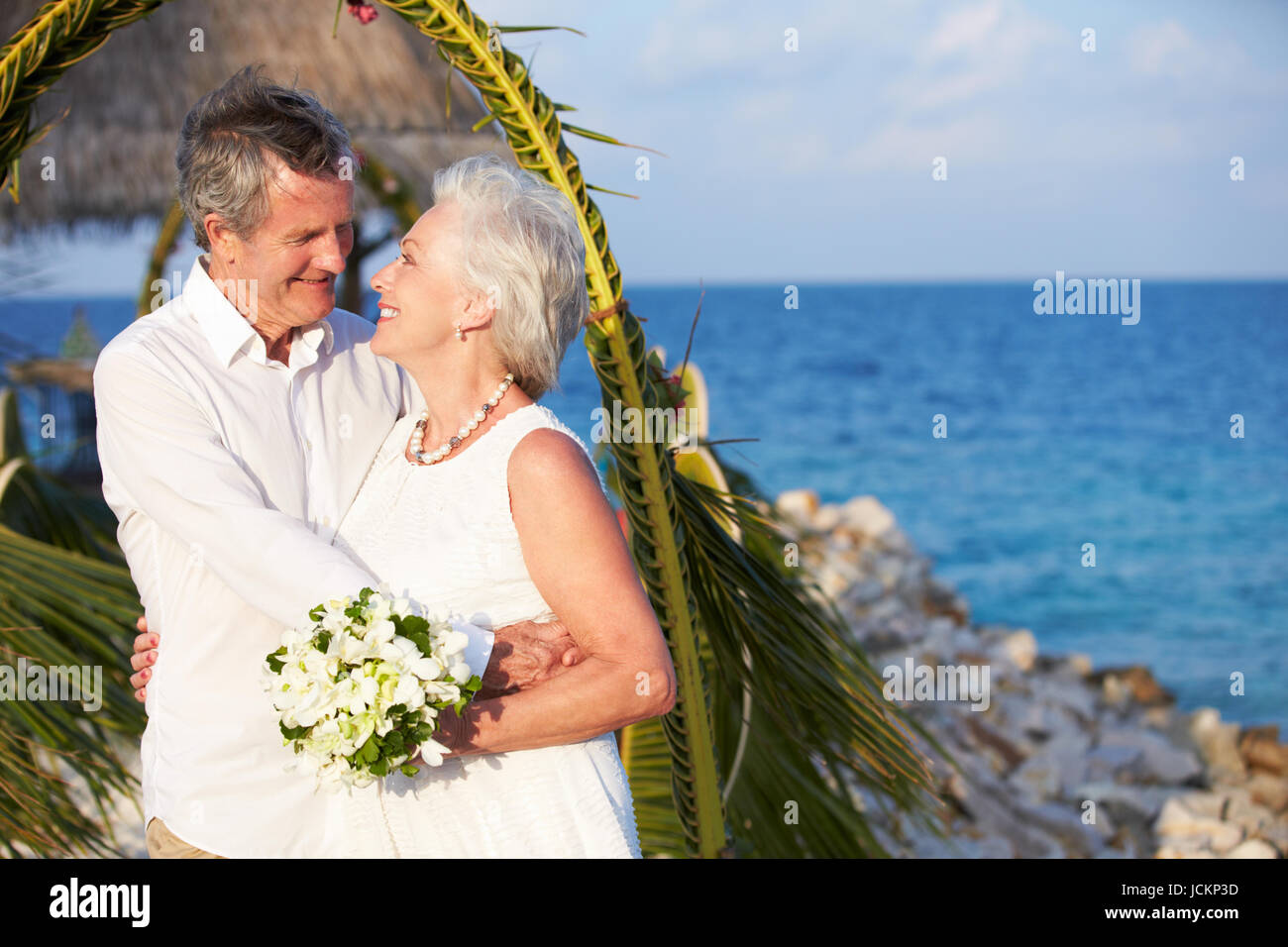 Senior Couple Getting Married In Beach Ceremony Stock Photo - Alamy