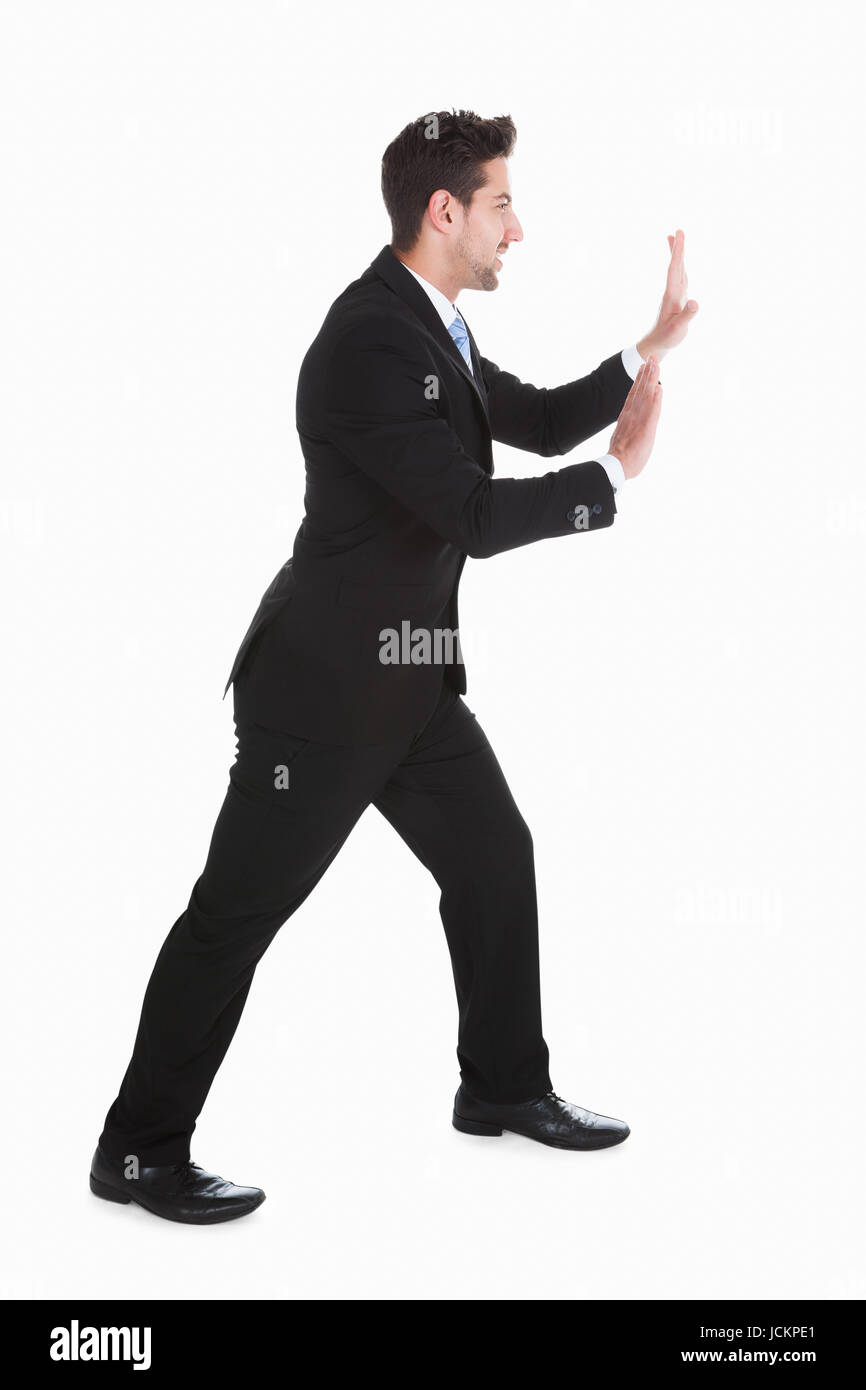 Corporate man pushing cutout hi-res stock photography and images - Alamy