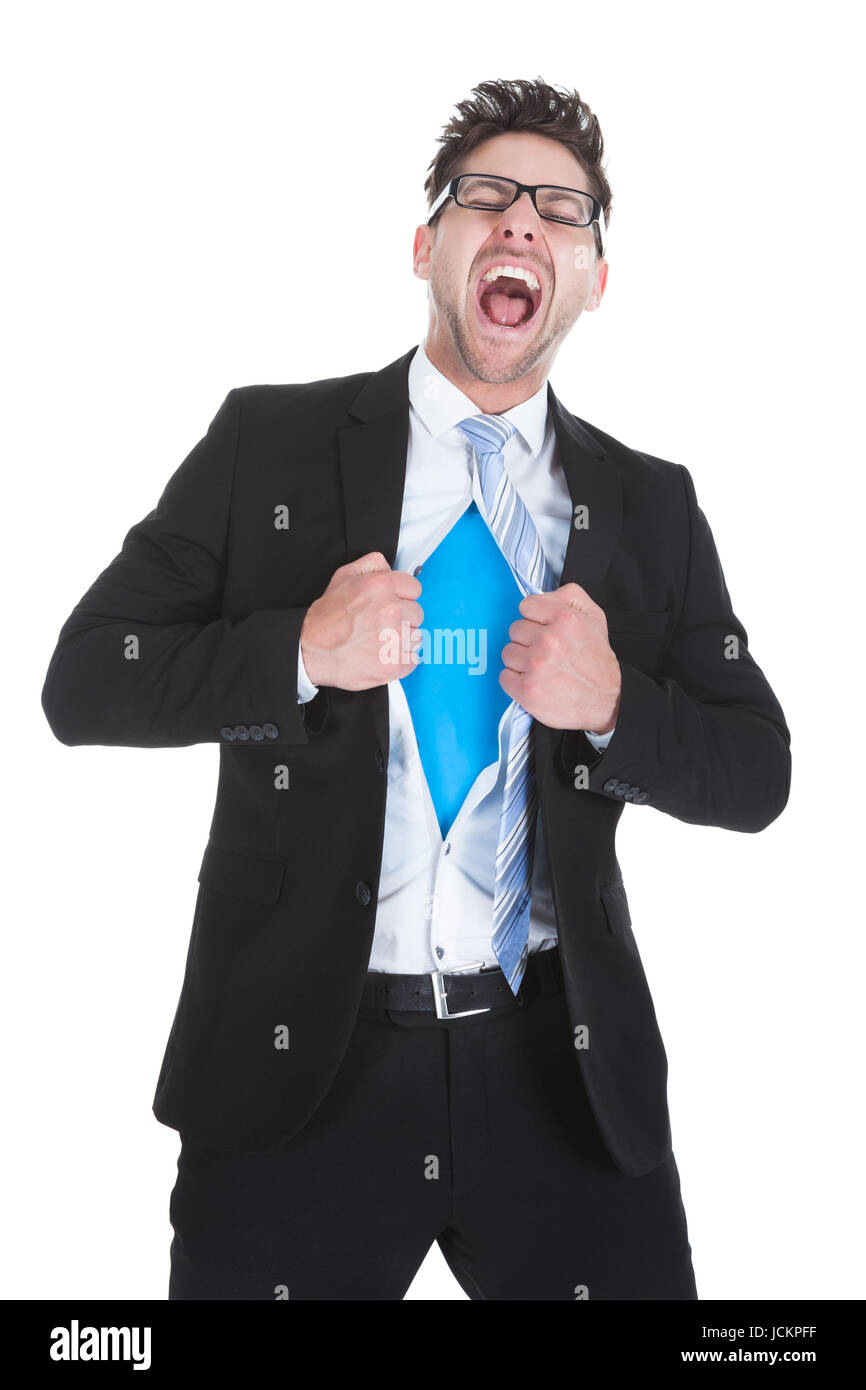 Young businessman tearing apart his suit over white background Stock ...