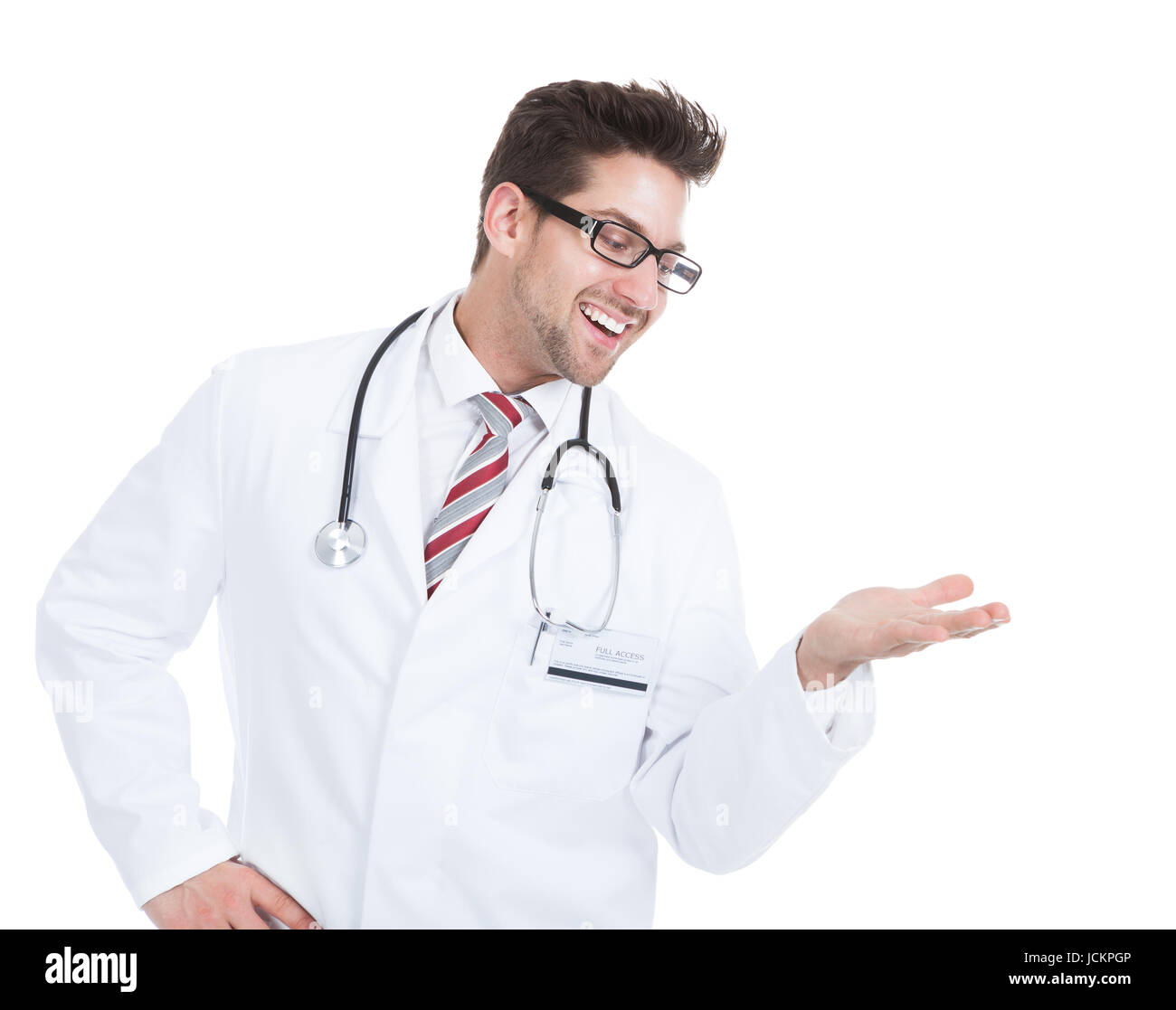 Portrait of young male doctor giving presentation over white background ...