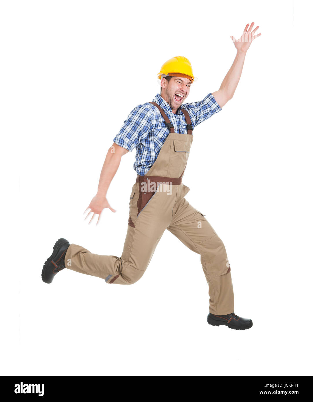 Full length portrait of excited manual worker running over white ...