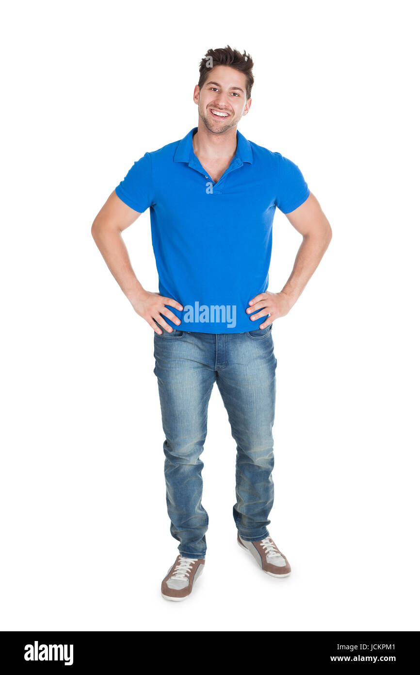 Full length of handsome mid adult man in casuals over white background ...