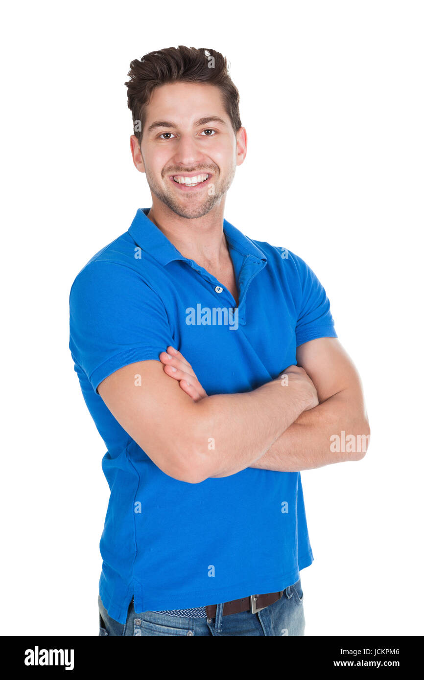 Full length of handsome mid adult man in casuals over white background ...