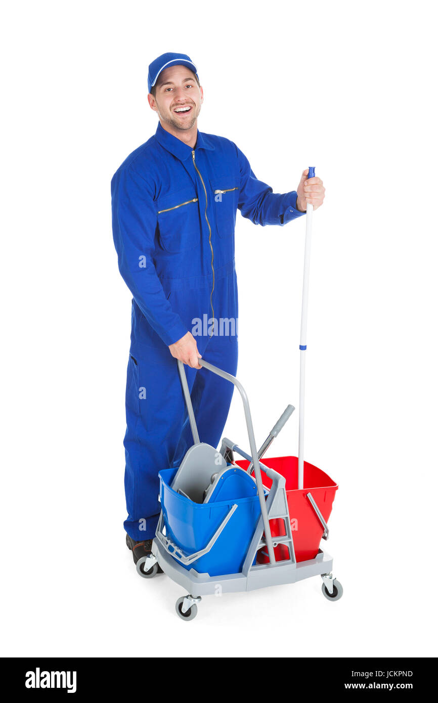 Full length portrait of confident cleaner showing thumbs up over white ...