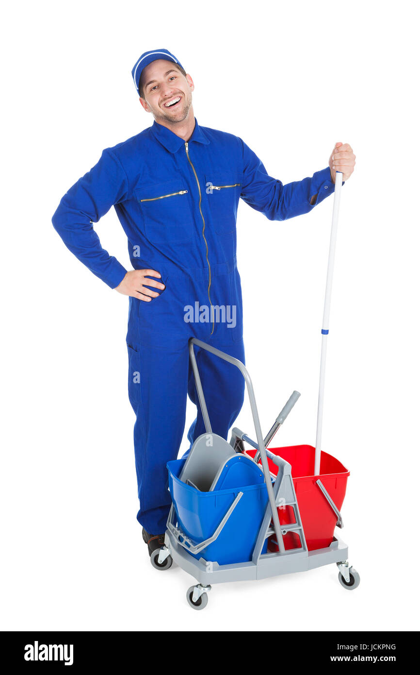 Full length portrait of confident cleaner showing thumbs up over white ...