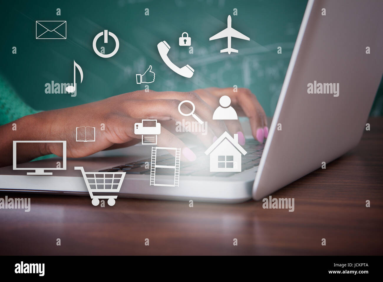 Cropped image of woman using laptop with various vector icons Stock ...