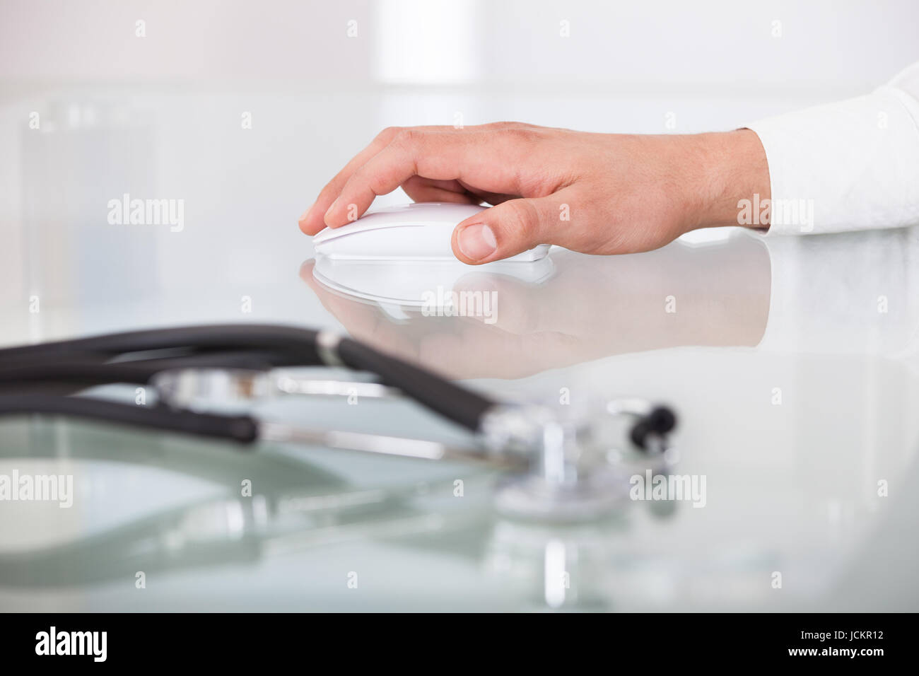cropped image of doctor's hand using mouse in clinic Stock Photo - Alamy