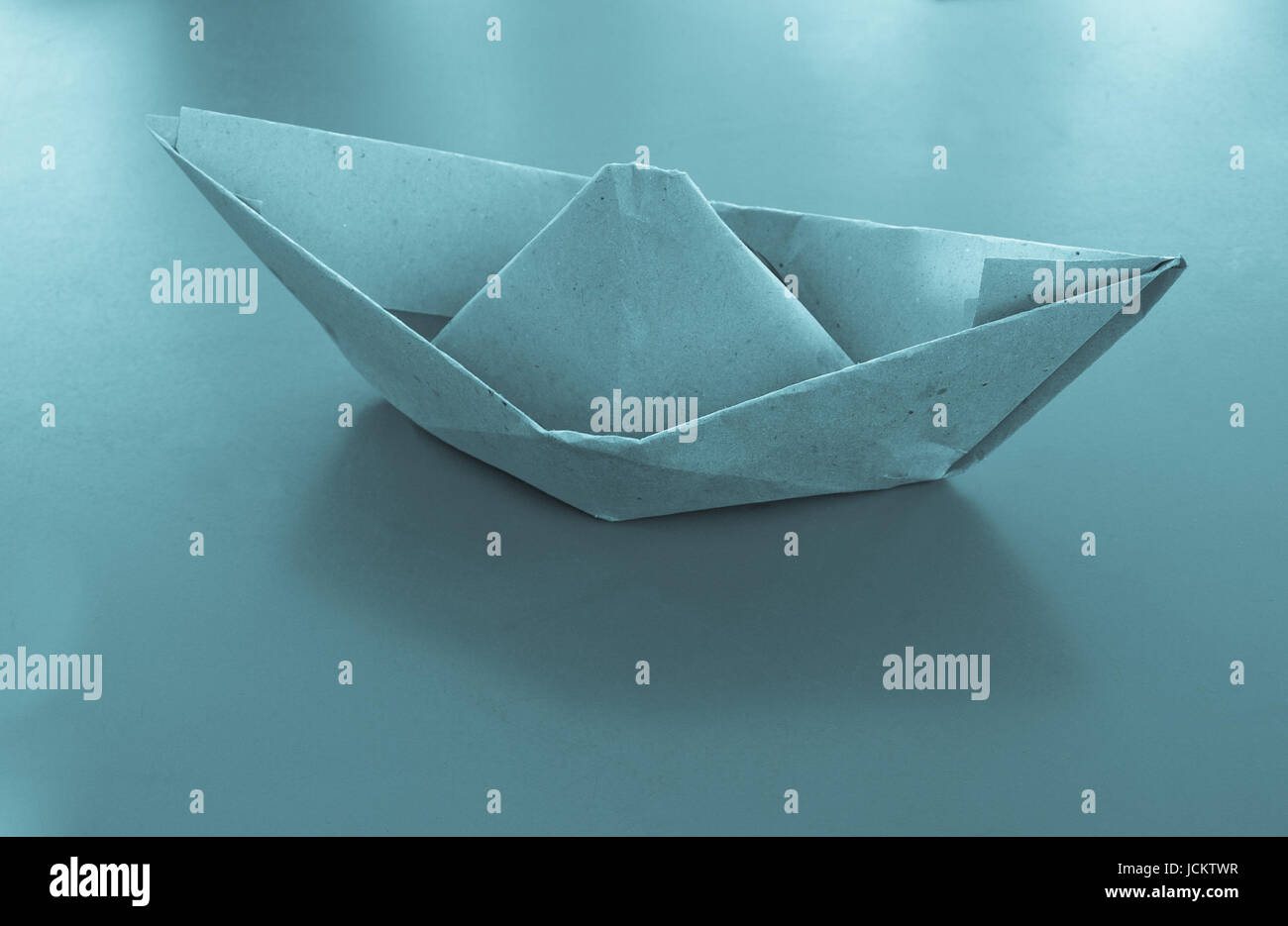 Toy paper boat over a sea blue cardboard - cool cyanotype Stock Photo ...