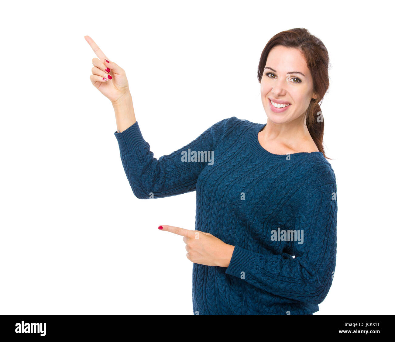 Brunette woman with two finger point up Stock Photo - Alamy