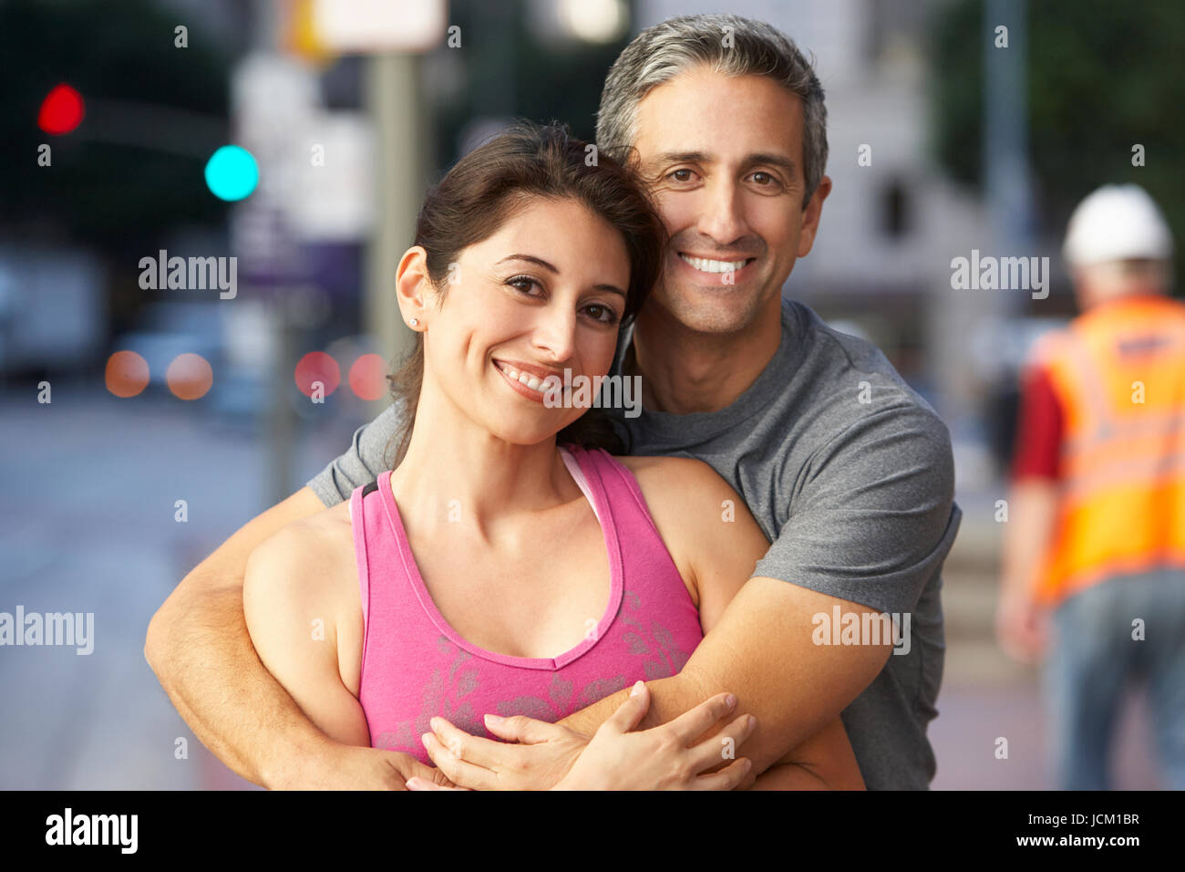 Portrait Of Male And Female Runners On Urban Street Stock Photo - Alamy