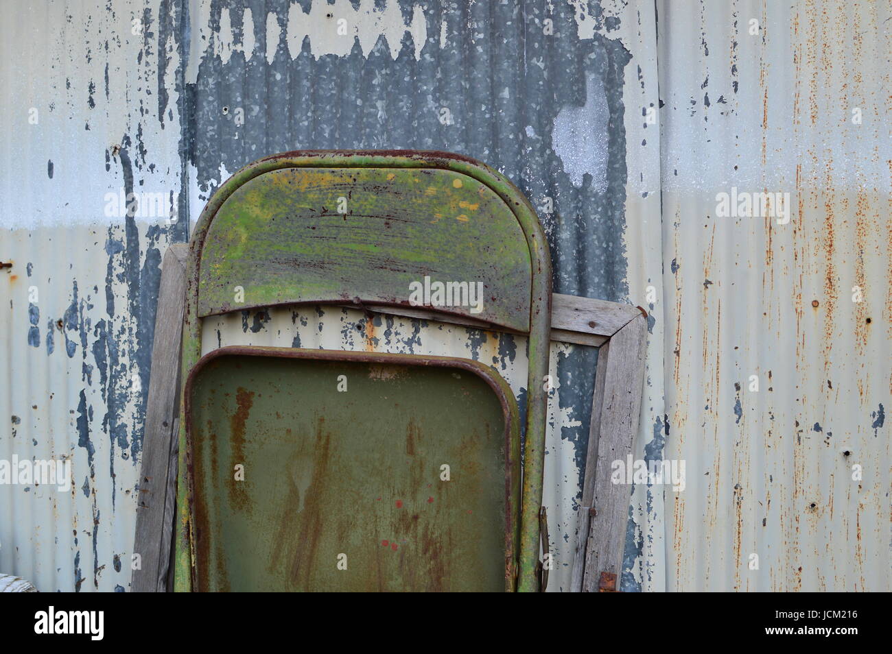 rusty green chair Stock Photo - Alamy