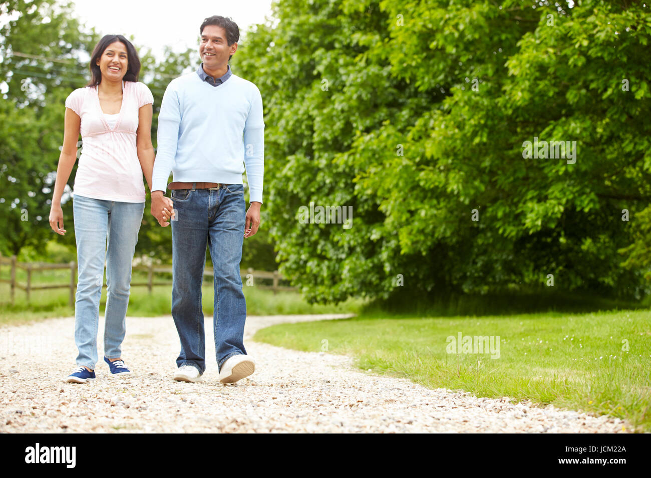 Indian couple walking hi-res stock photography and images - Alamy