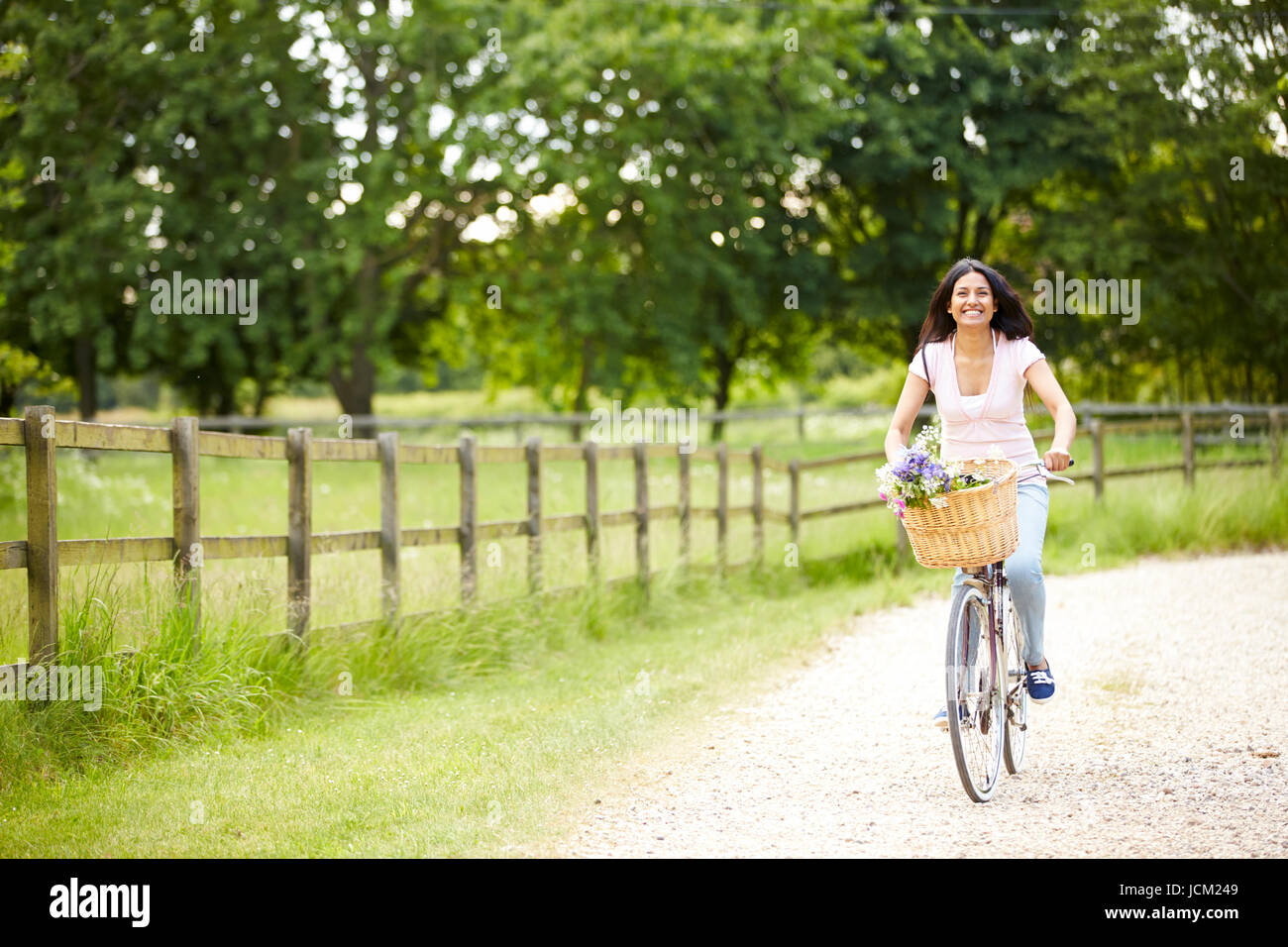 Indian Woman On Cycle Ride In Countryside Stock Photo - Alamy