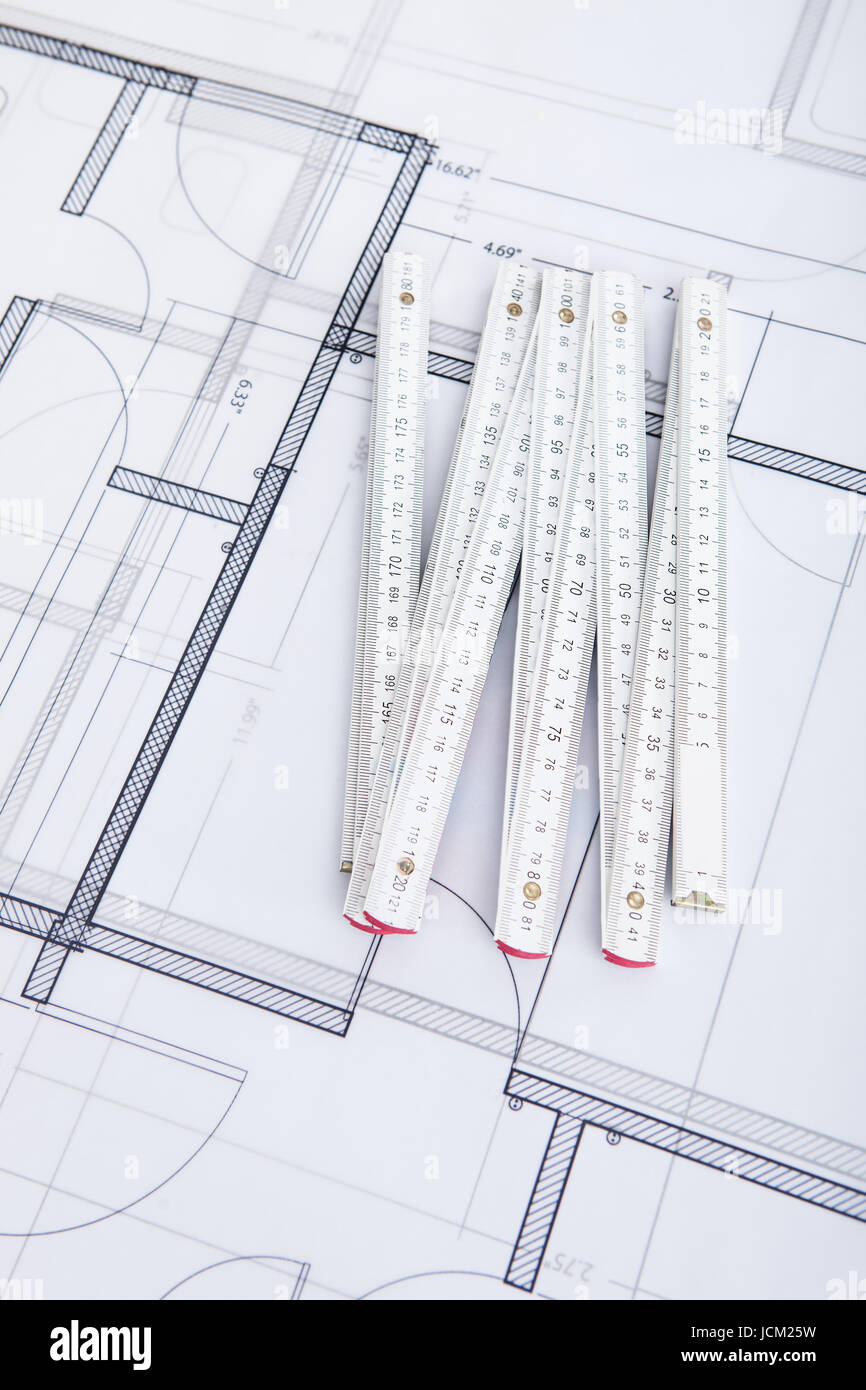 Closeup photo of folding ruler on blueprint Stock Photo - Alamy