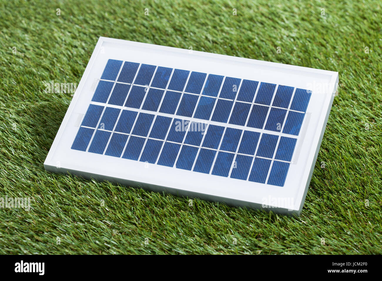 Closeup photo of solar panel on grass Stock Photo - Alamy