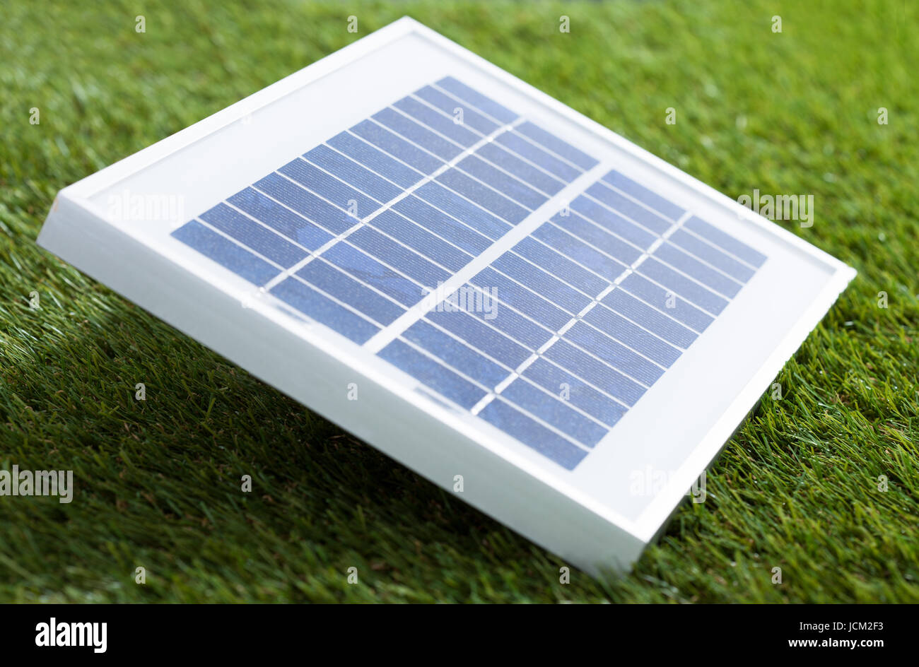 Closeup photo of solar panel on grass Stock Photo - Alamy