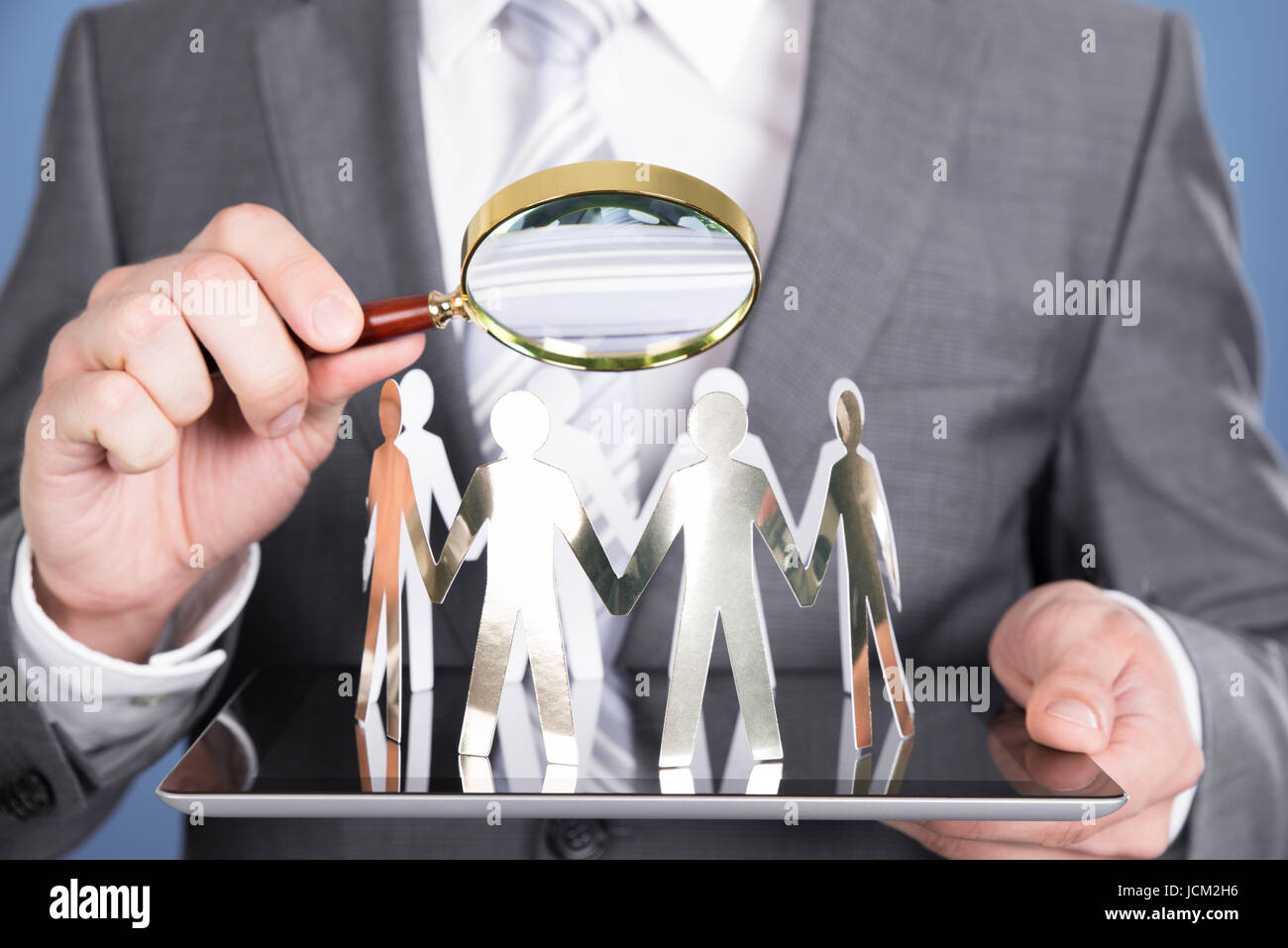 Helping hand with magnifying glass hi-res stock photography and images ...