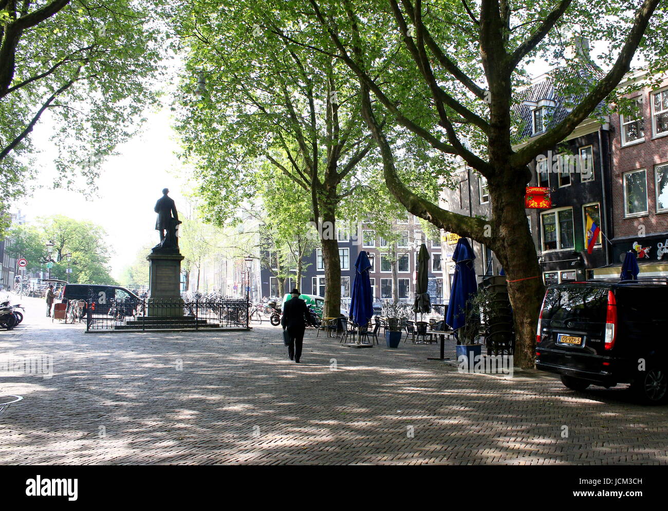 Springtime morning under the shaded trees of Thorbeckeplein, inner city ...
