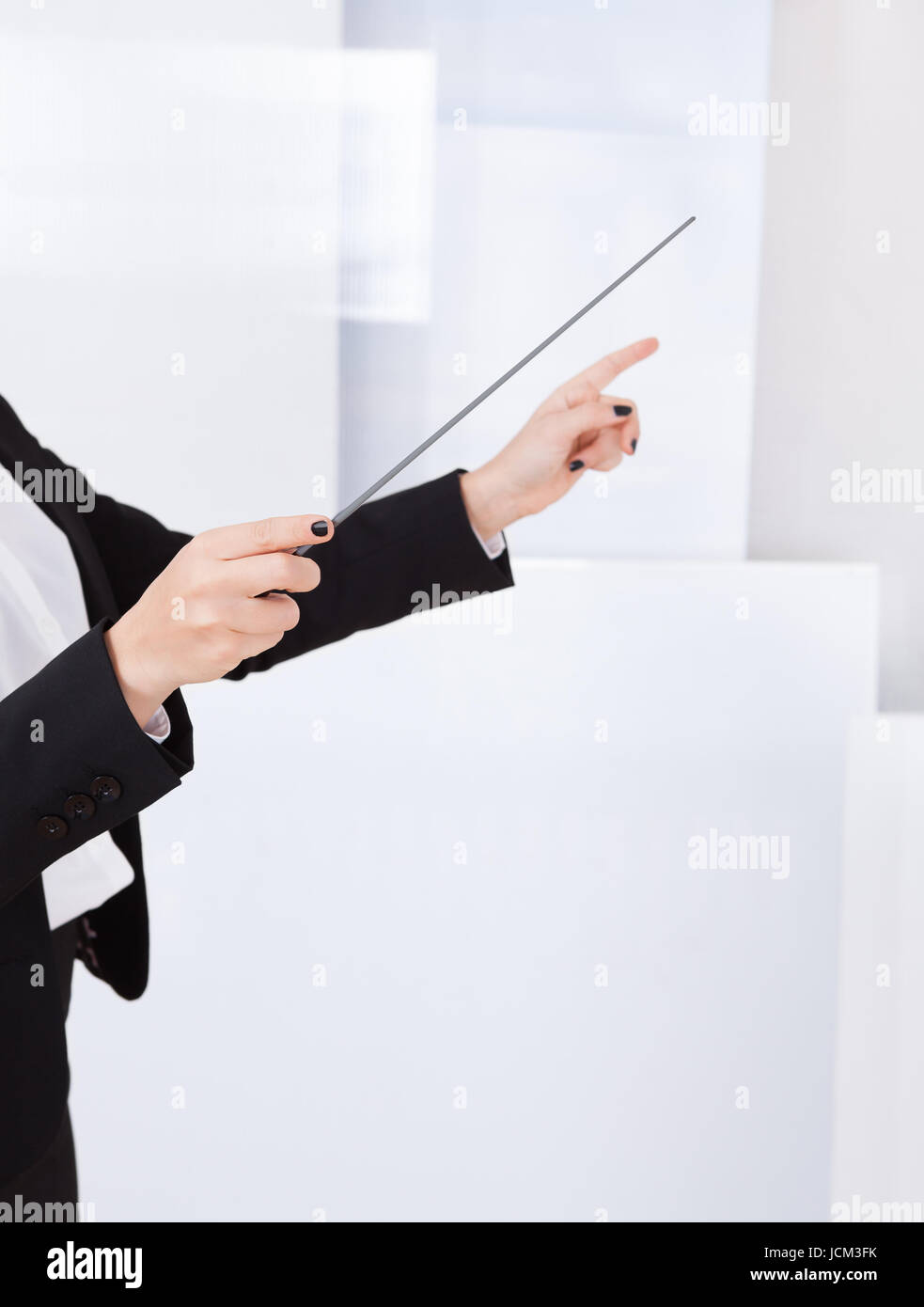 Female conductor holding a baton hi-res stock photography and images ...