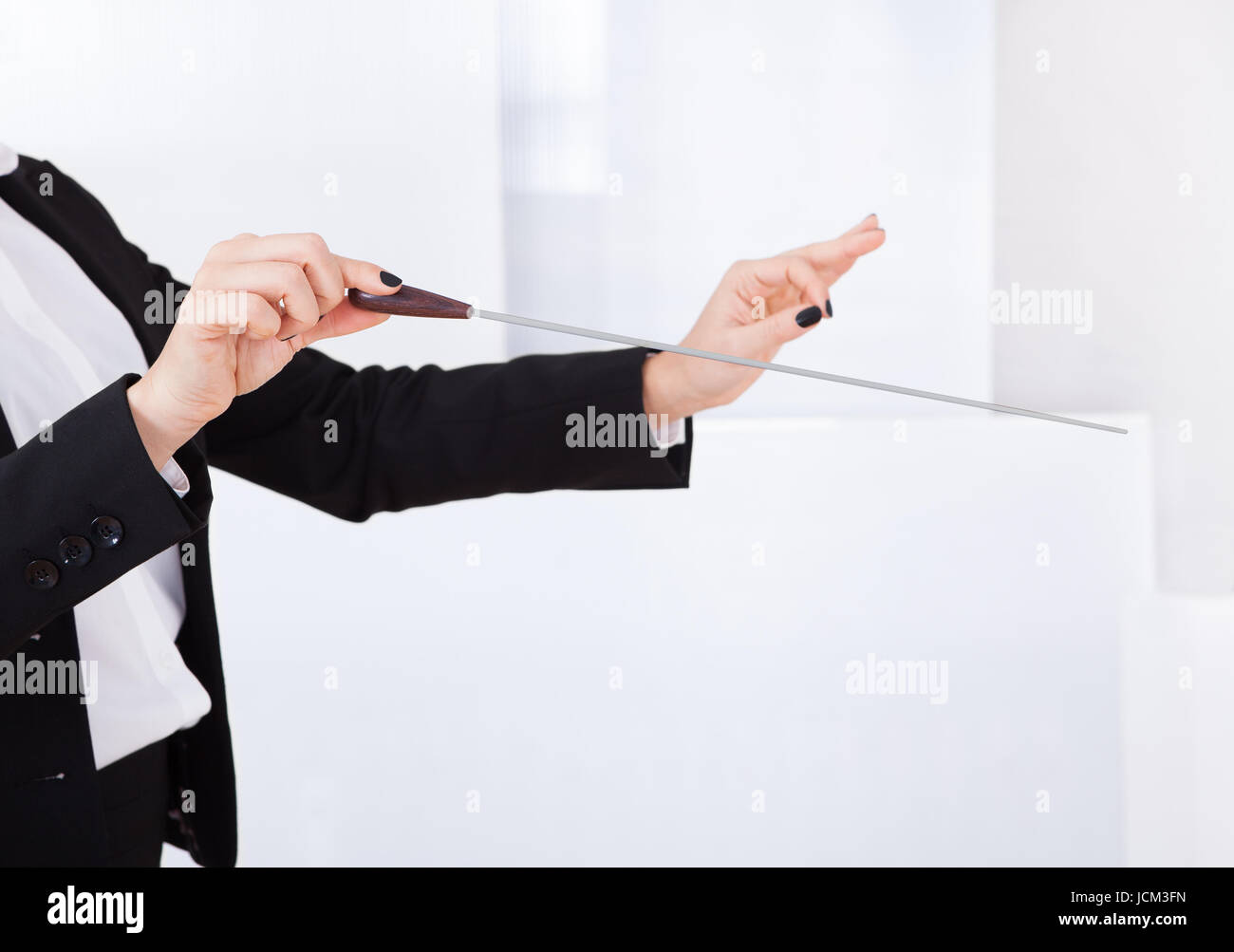 Female conductor holding a baton hi-res stock photography and images ...