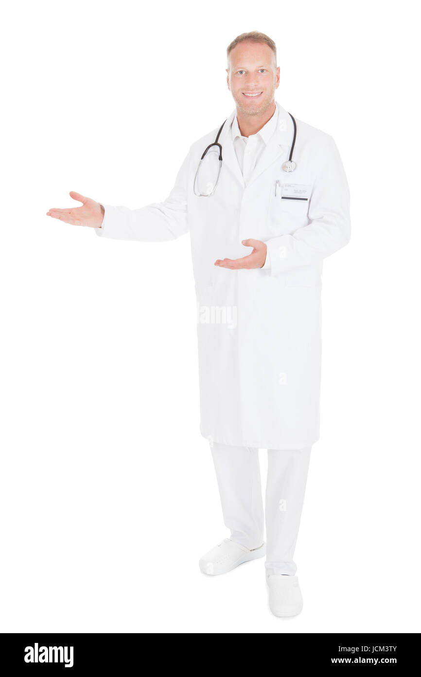 Full length portrait of smiling mid adult doctor giving presentation ...