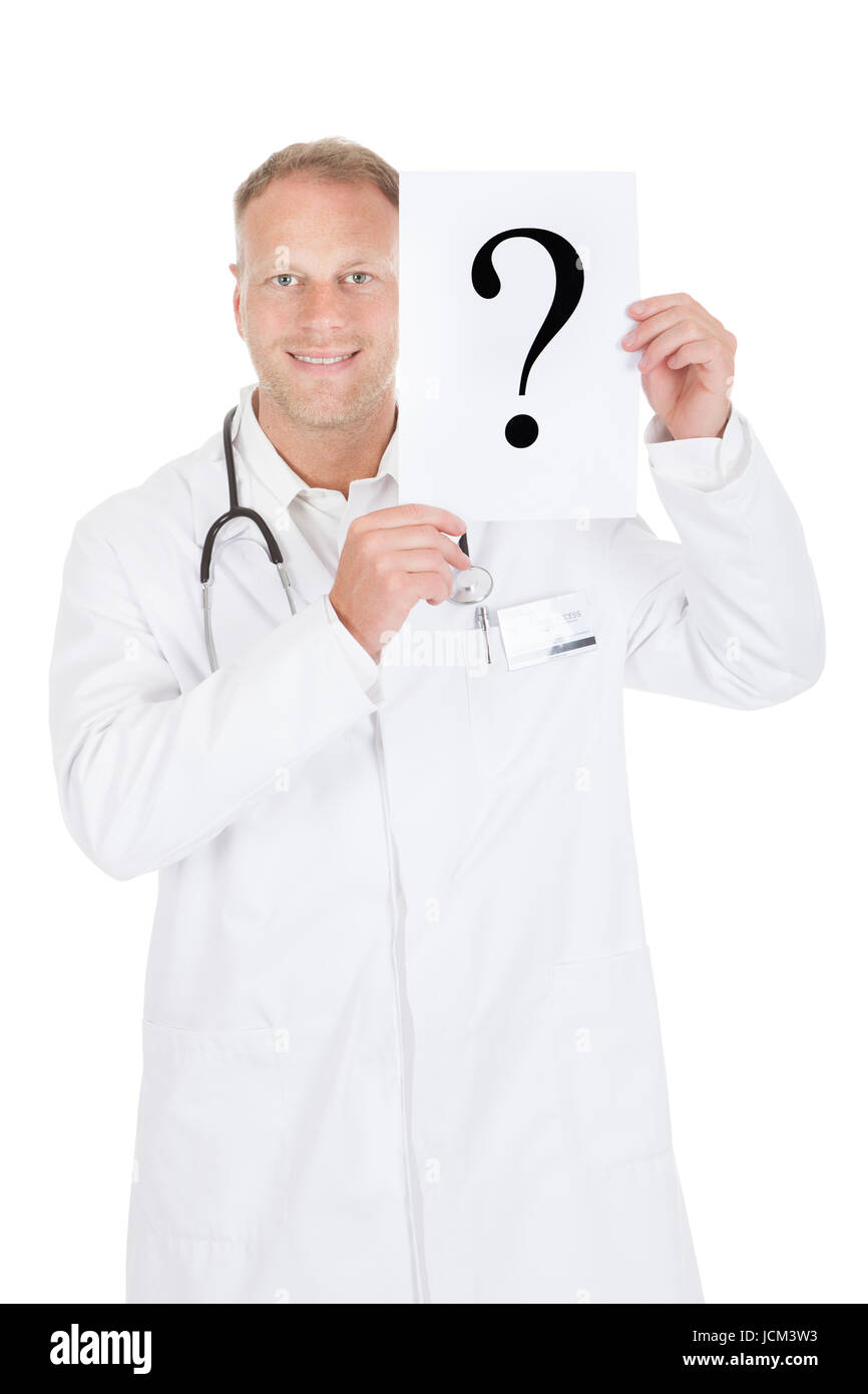 Portrait of smiling mid adult doctor holding paper with question mark ...