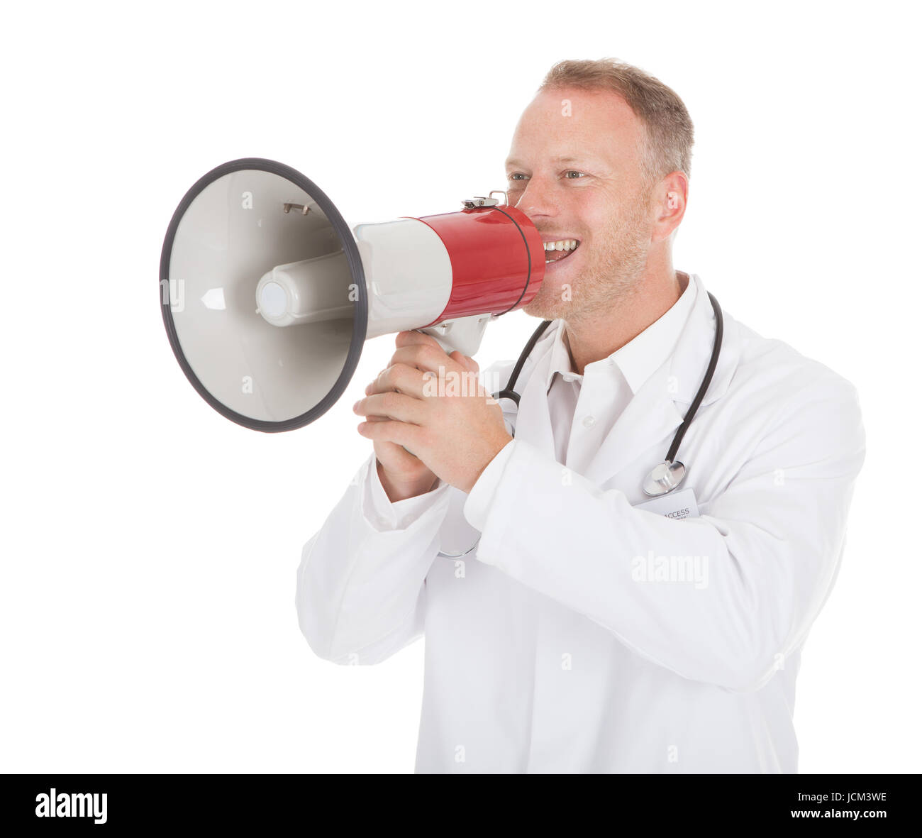 Young male doctor screaming into megaphone over white background Stock ...