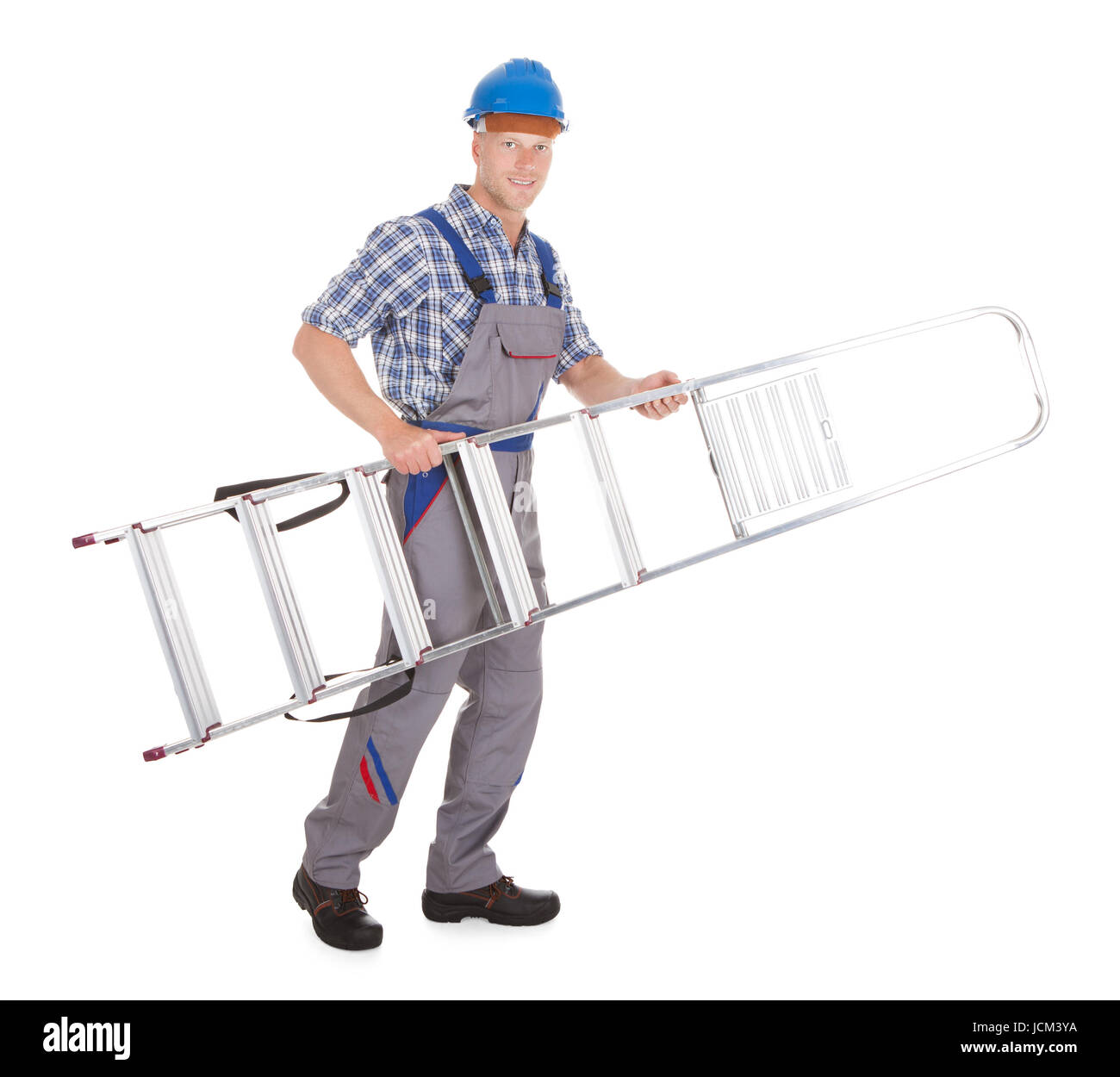 Full length portrait of confident manual worker carrying step ladder ...