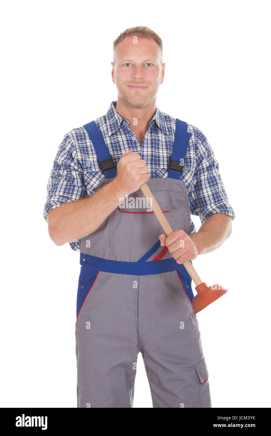 Full length portrait of excited young male plumber holding plunger over ...