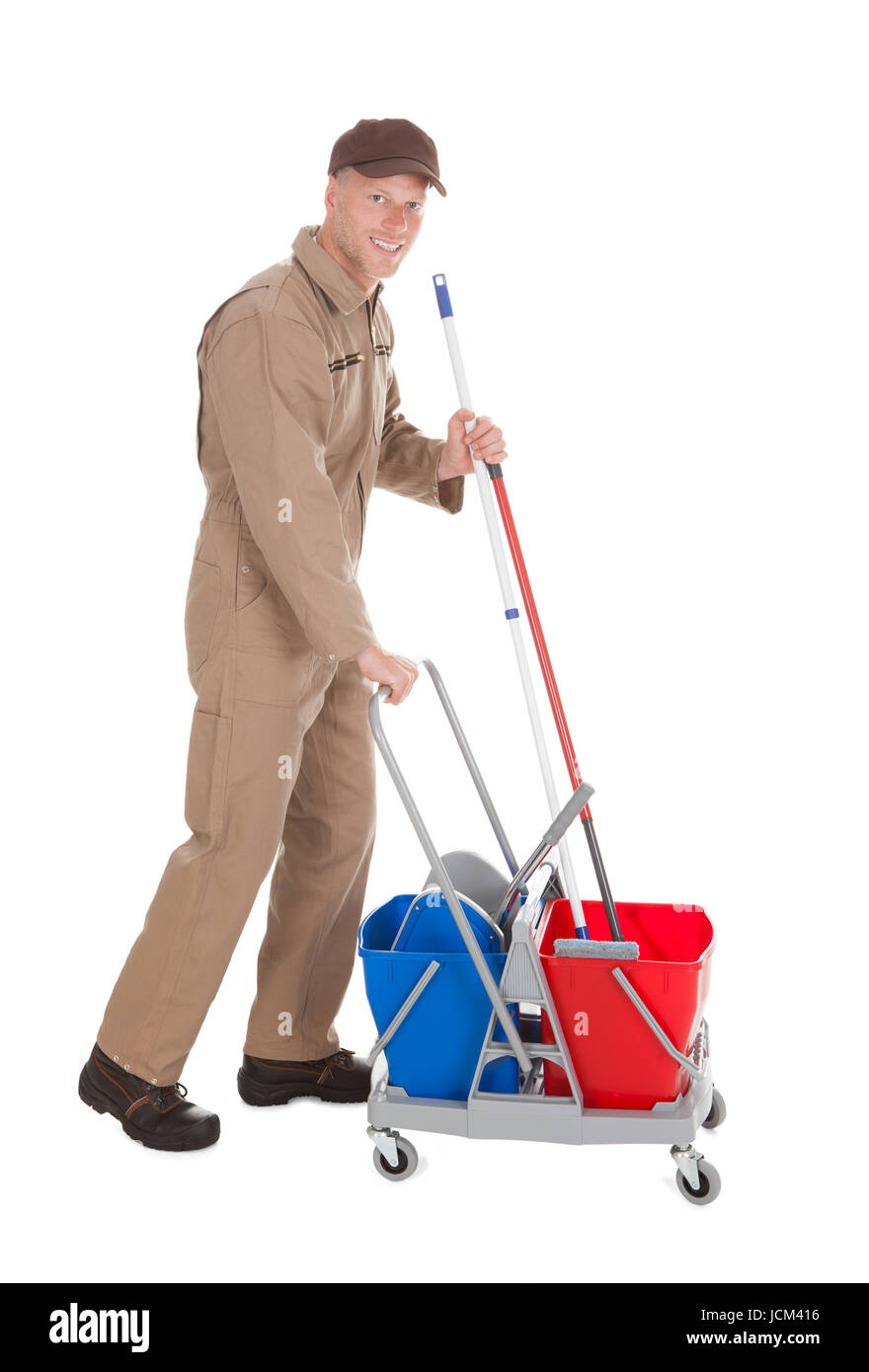 Full length portrait of confident cleaner showing thumbs up over white ...
