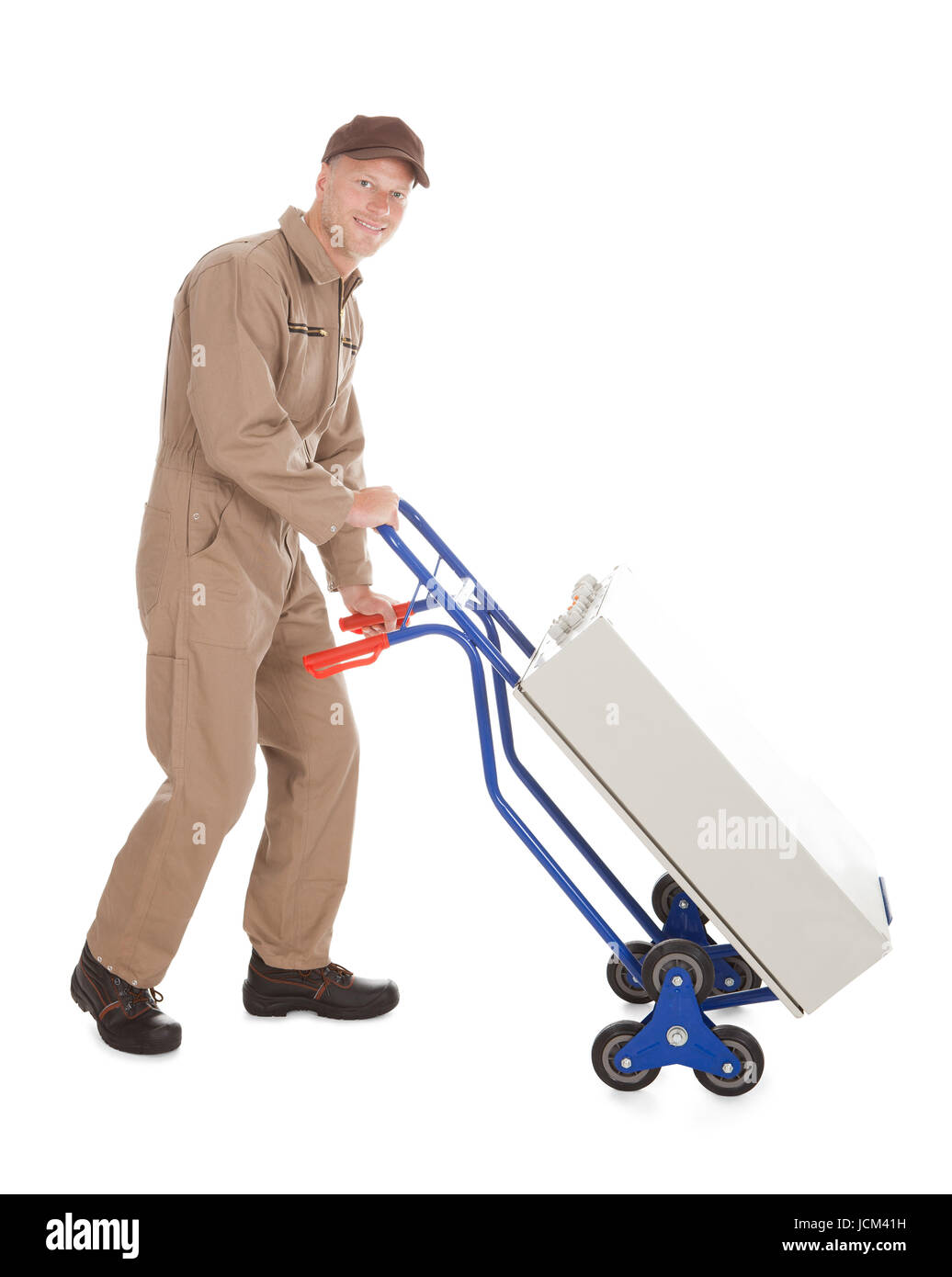 Full length portrait of delivery postman pushing machine on cart over ...