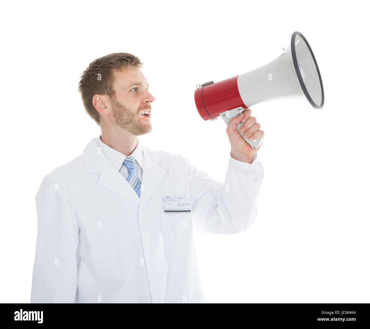 Young male doctor screaming into megaphone over white background Stock ...