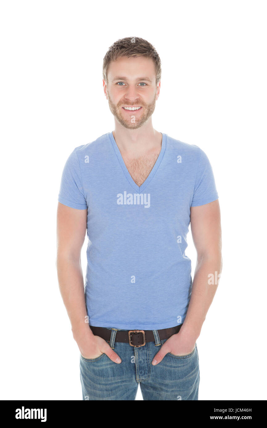 Full length of handsome mid adult man in casuals over white background ...