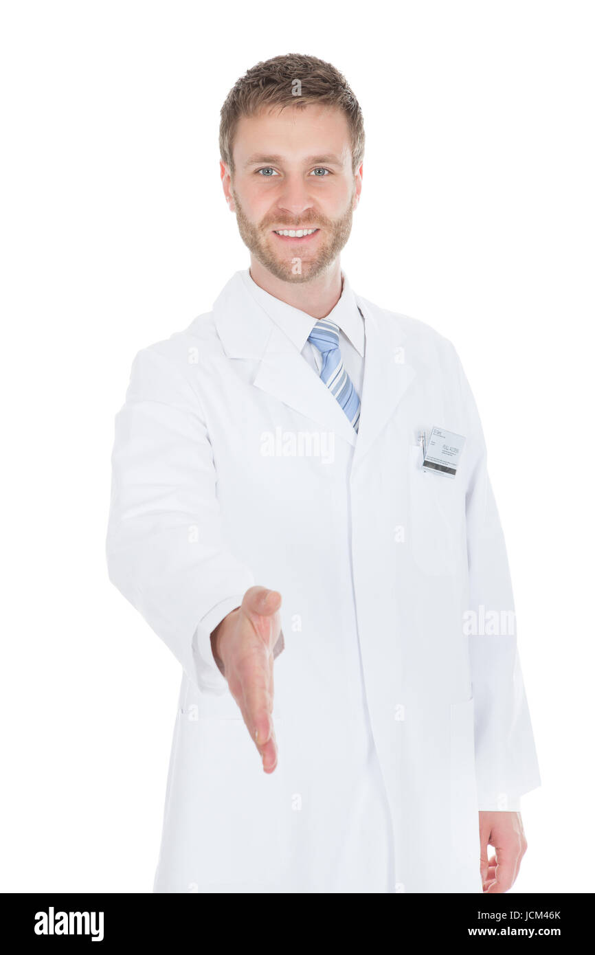 Portrait of smiling male doctor offering handshake over white ...
