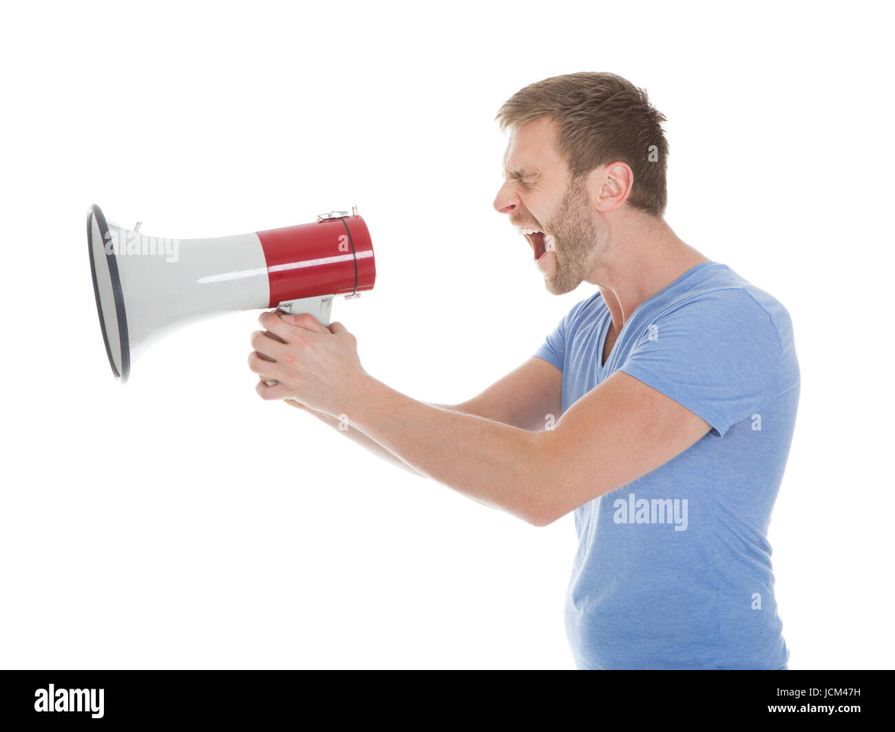Full length of man screaming into megaphone over white background Stock ...