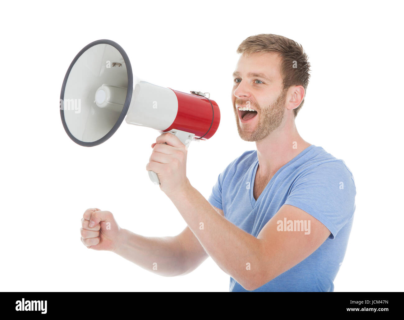 Full length of man screaming into megaphone over white background Stock ...