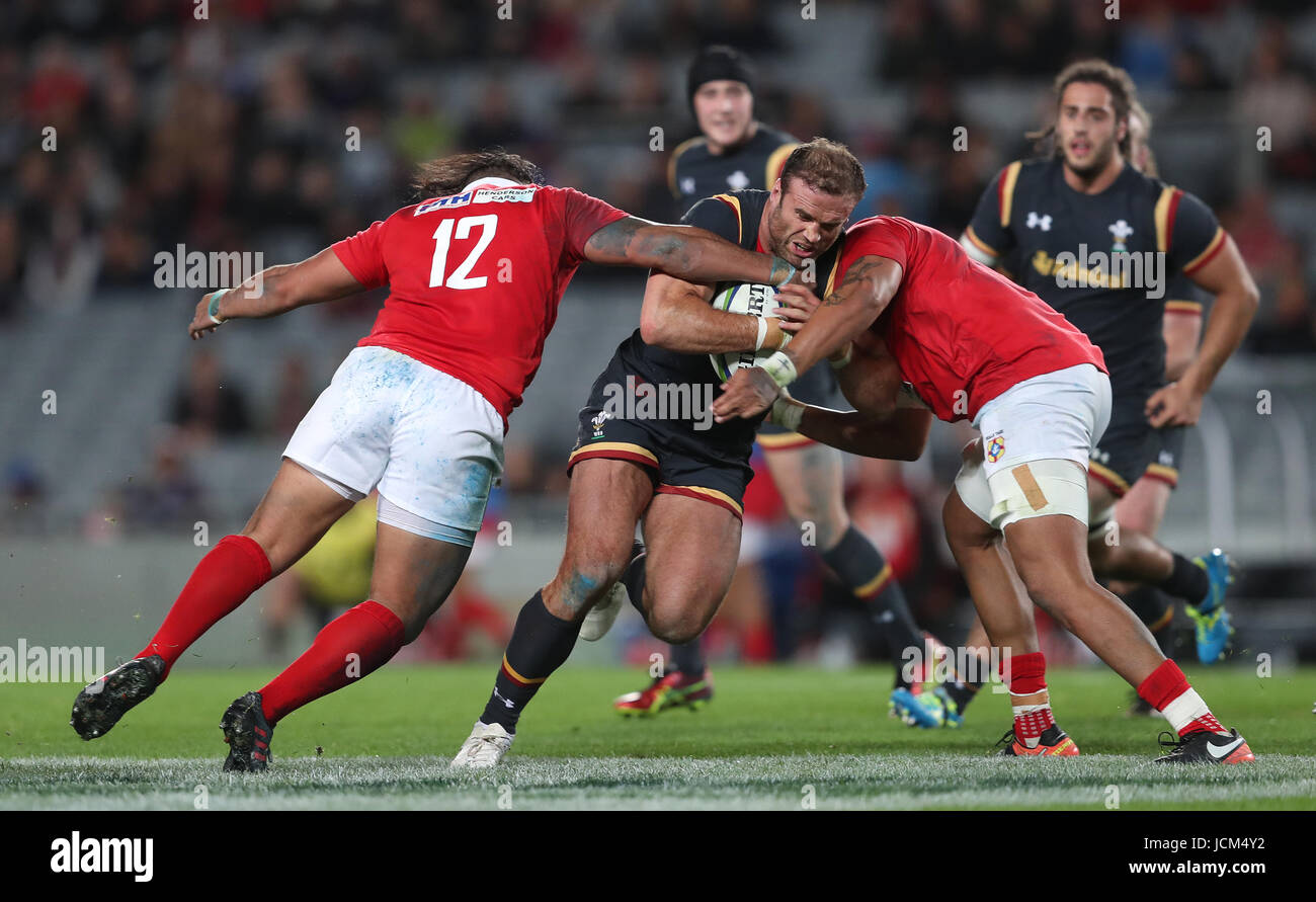 Wales' Jamie Roberts is tackled by Tonga's Vili Tahitu'a and Valentino ...