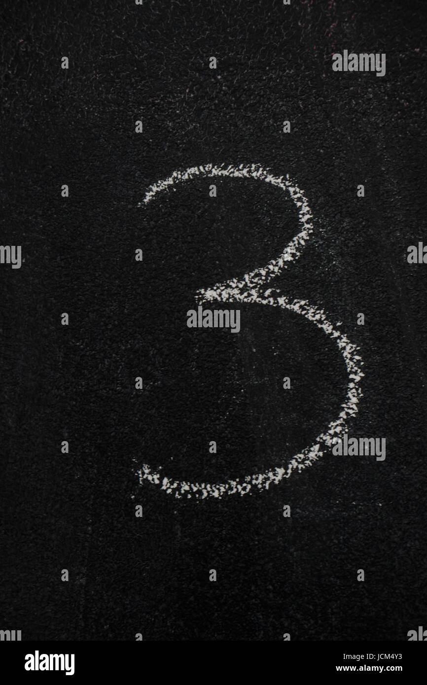 Number 3, three drawn with white chalk on blackboard. Education, school ...