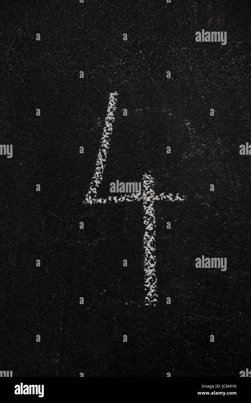 Number 4, four drawn with white chalk on blackboard. Education, school ...
