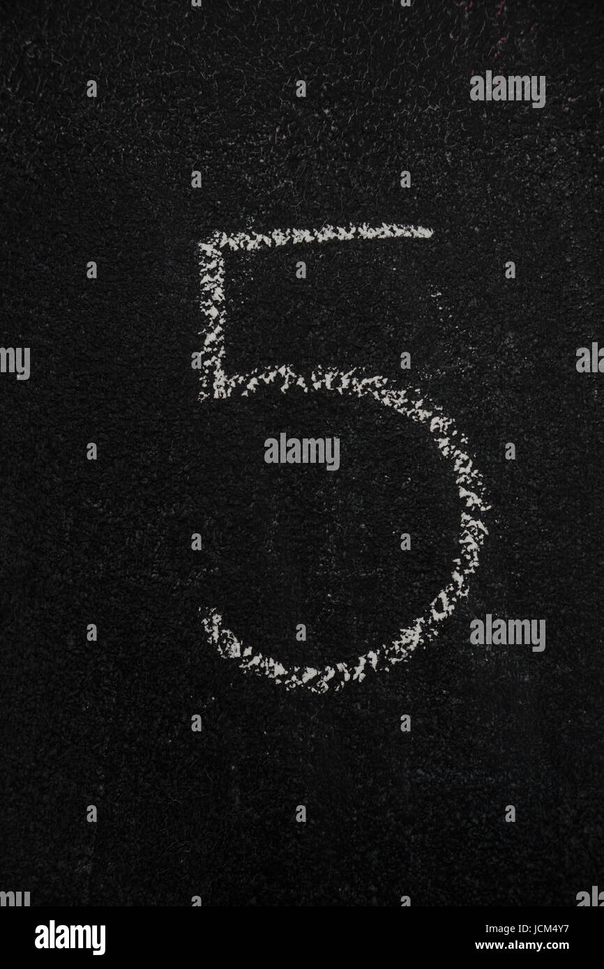Number 5, five drawn with white chalk on blackboard. Education, school ...
