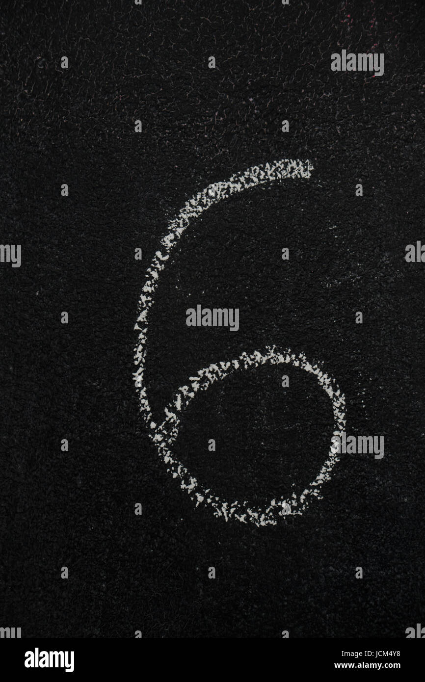 Number 6, six drawn with white chalk on blackboard. Education, school ...