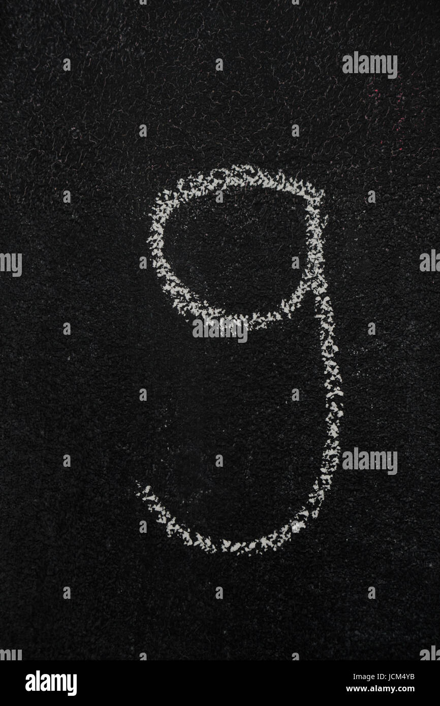 Number 9, nine drawn with white chalk on blackboard. Education, school ...