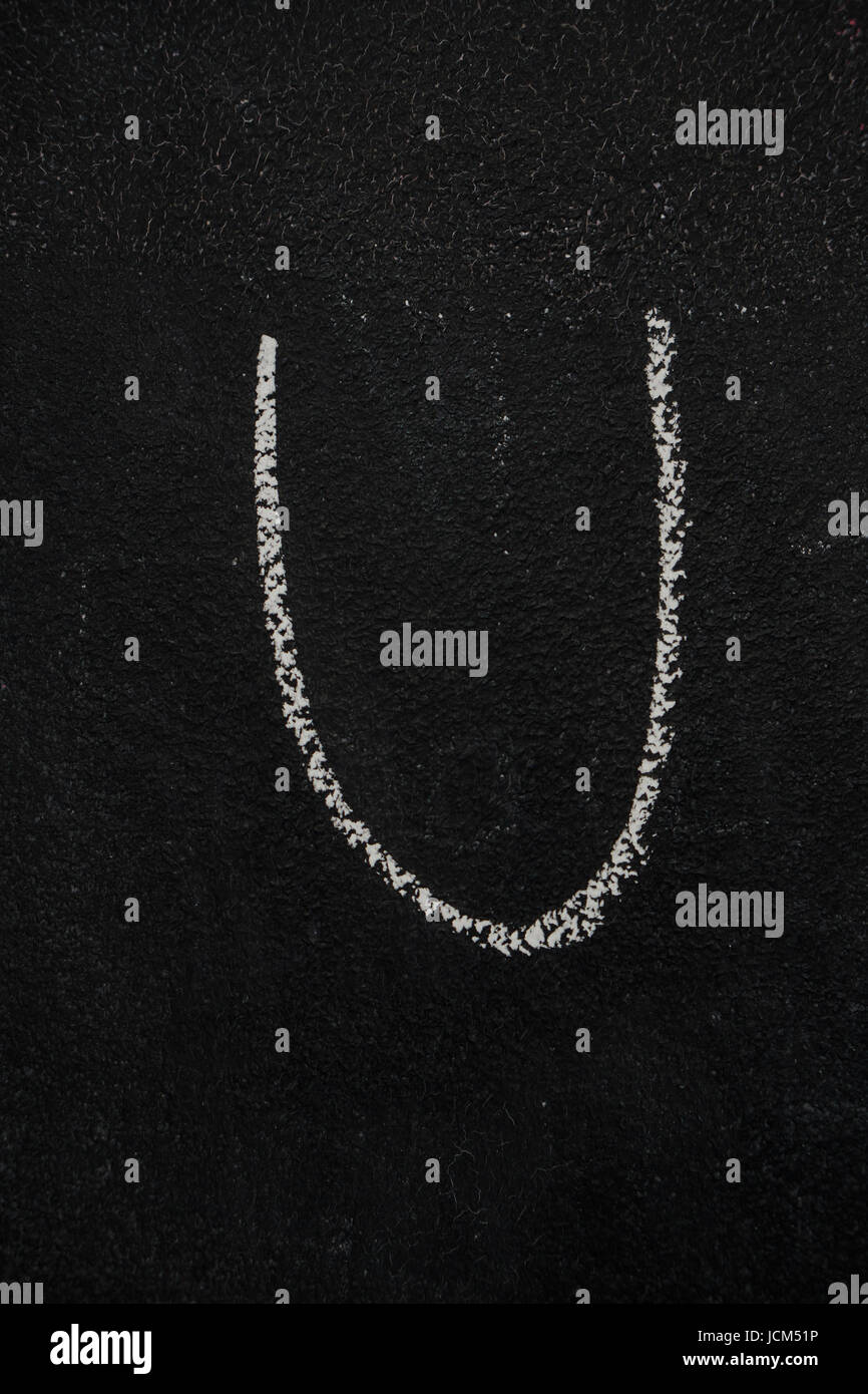Letter U drawn with white chalk on blackboard. Education, school ...