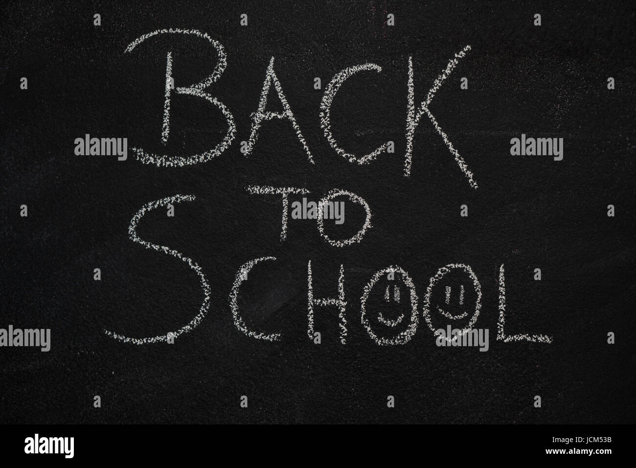 Back to school text written with chalk on blackboard. Education, school ...