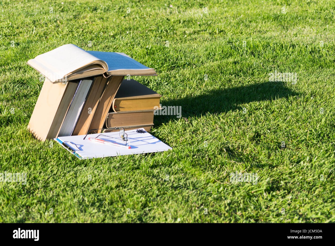 book on the grass Stock Photo - Alamy