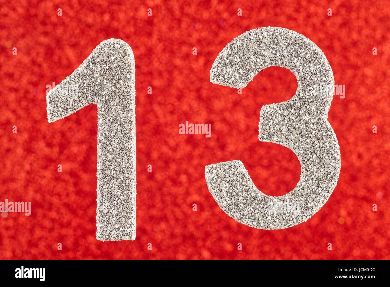 Number thirteen silver color over a red background. Anniversary ...