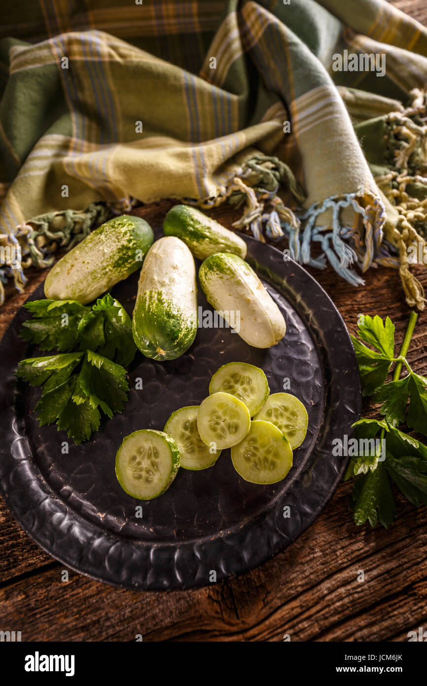 Still life of fresh whole and sliced cucumbers Stock Photo - Alamy