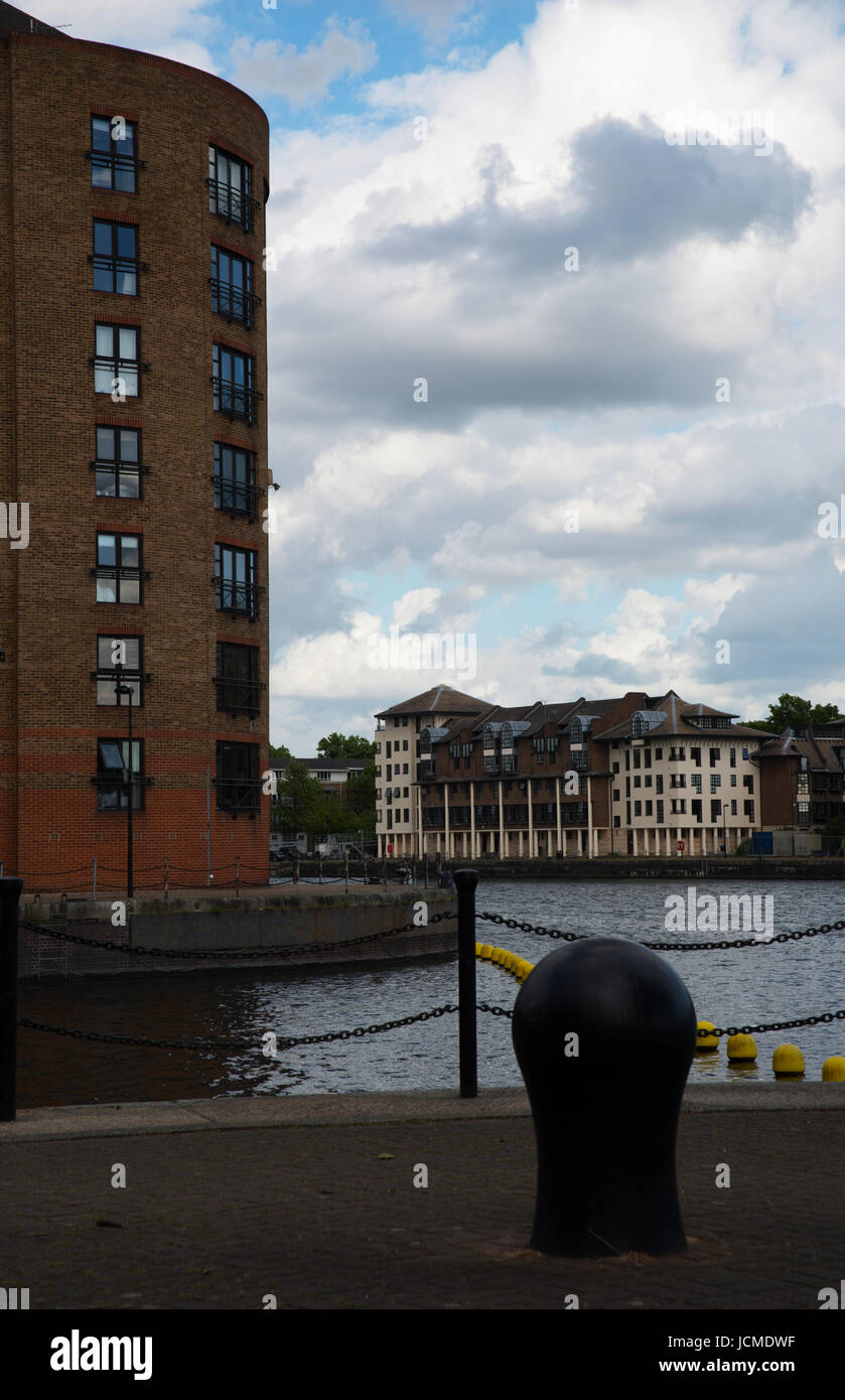 Wide river canal, view of residential buildings on the other side of ...