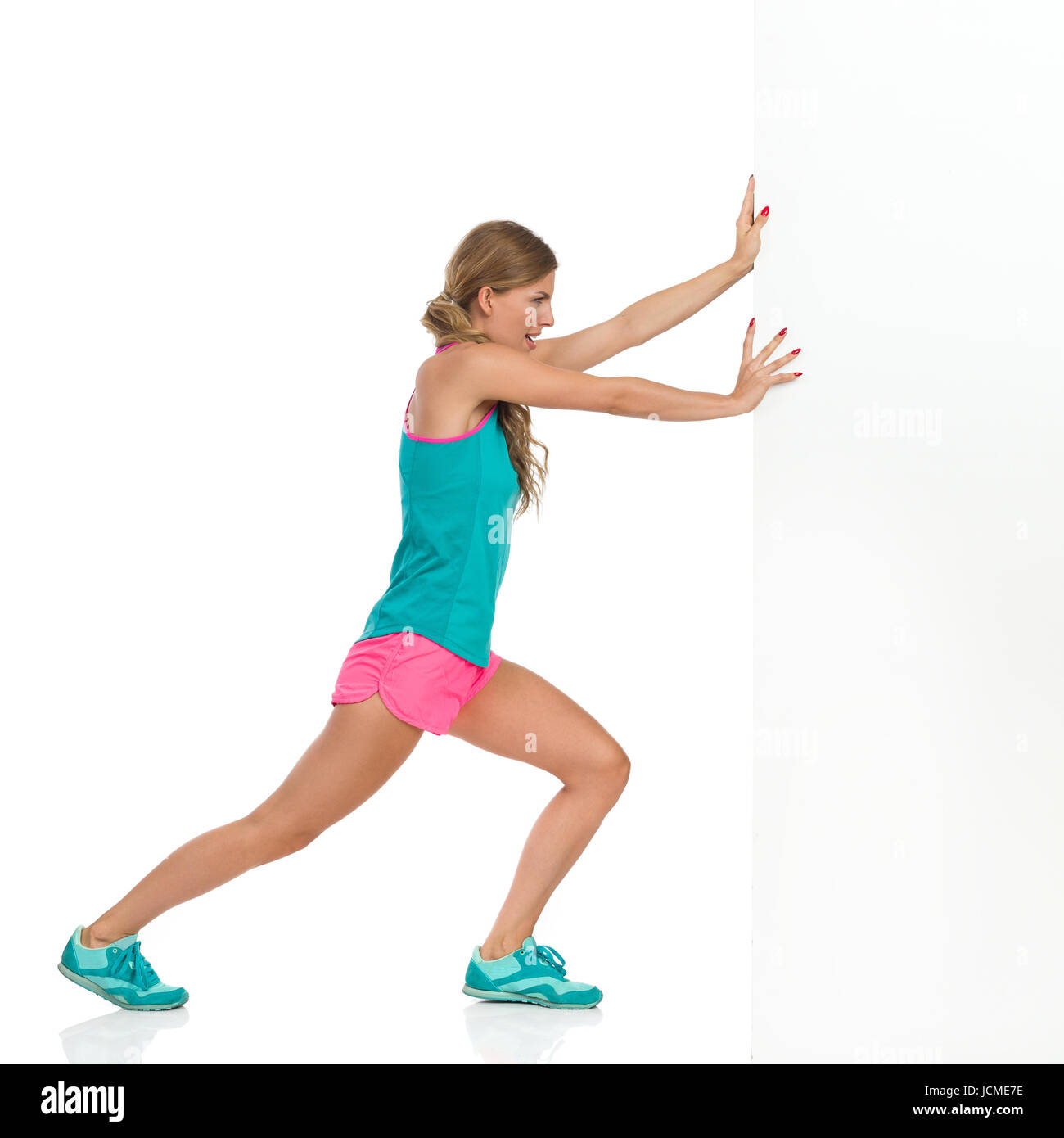 Girl pushing wall hi-res stock photography and images - Alamy